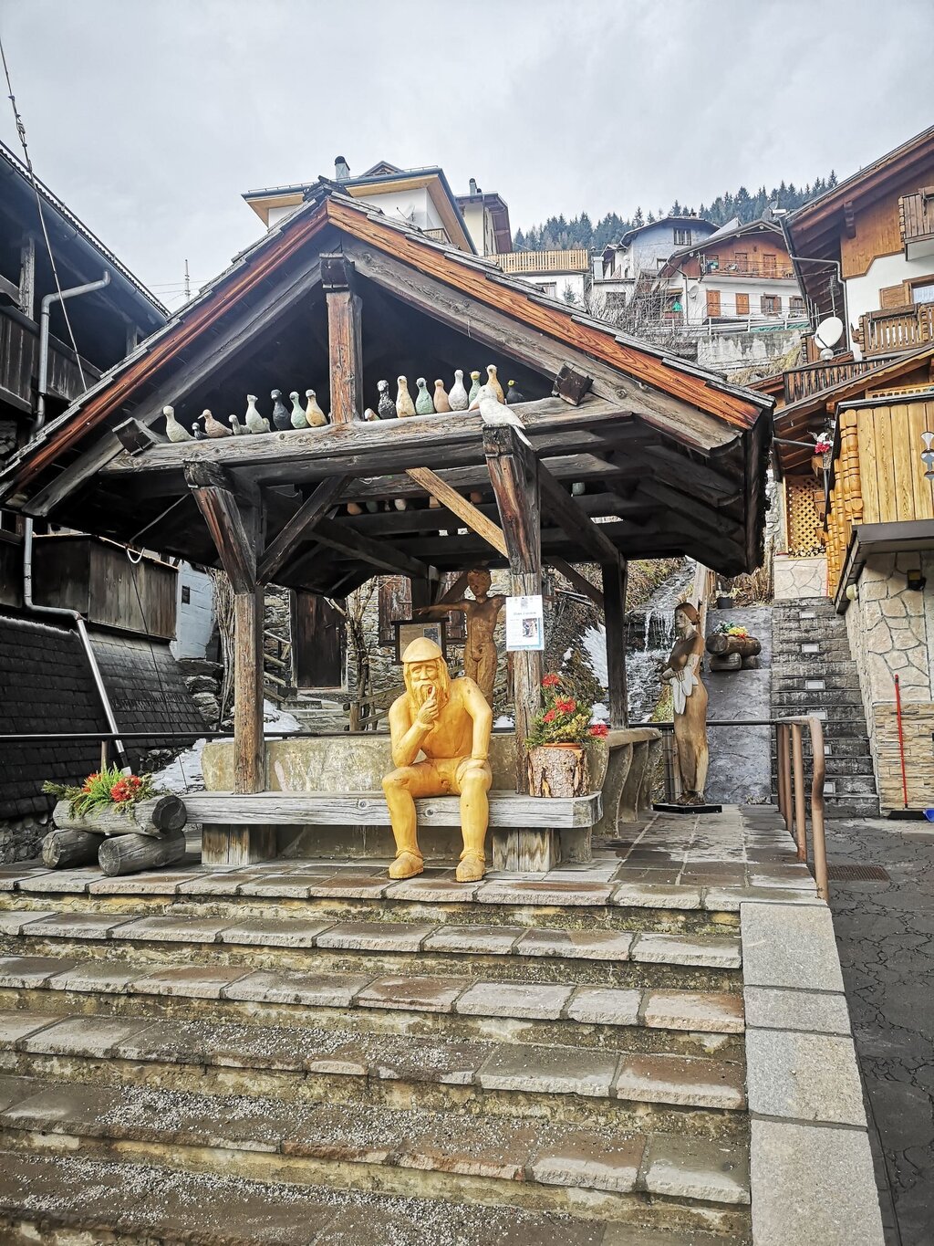 Houses and wooden sculptures in Costalta di Cadore